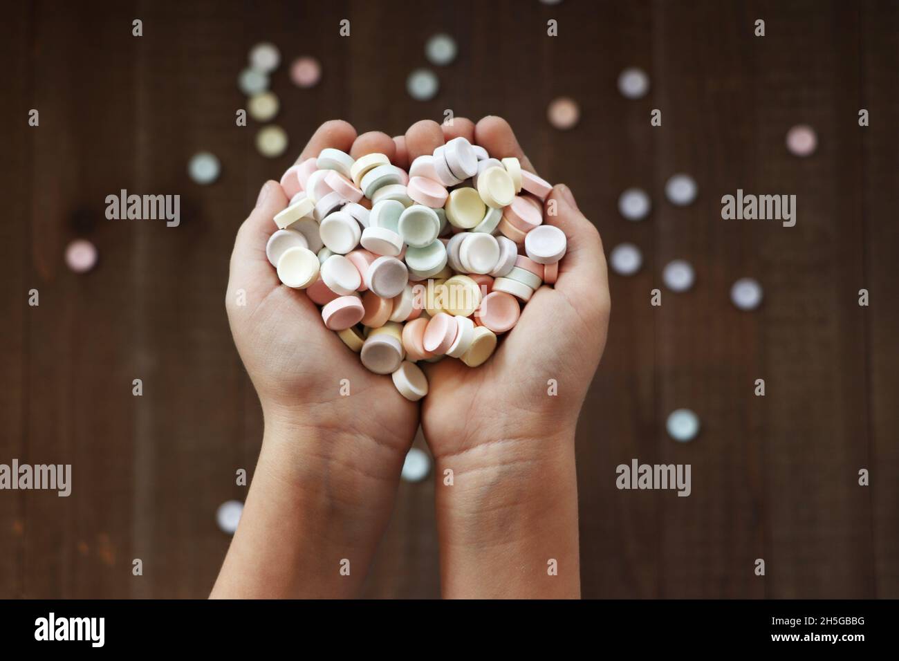 Handful of candy hi-res stock photography and images - Alamy