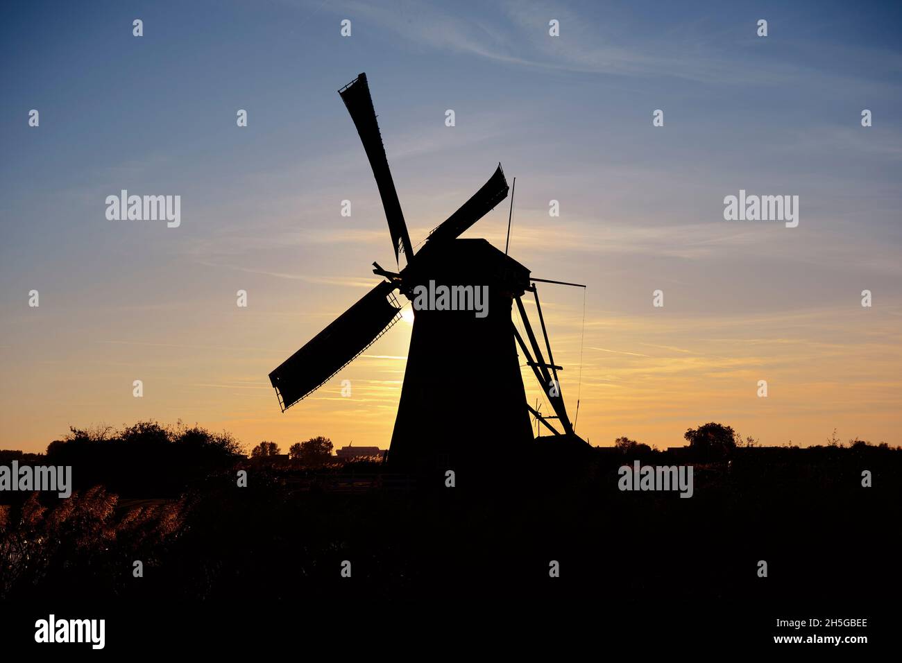 Silhouette windmill on farm scenery hi-res stock photography and images ...