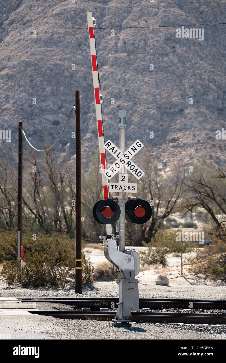 A Railroad crossing barracade in the desert Stock Photo - Alamy