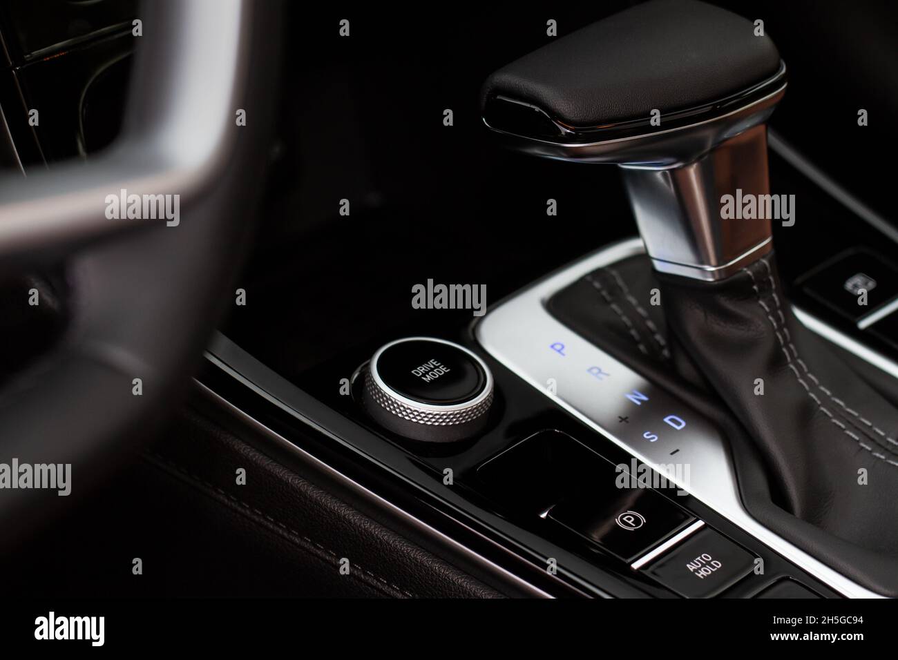 Modern car drive mode selector. Suspension and wheel drive control ...