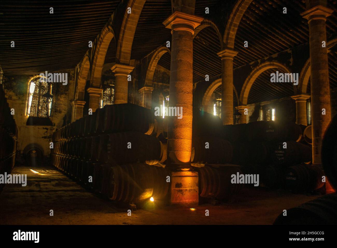 Bodega in Jerez de la Frontera. Old cellar of barrells storing wine ...