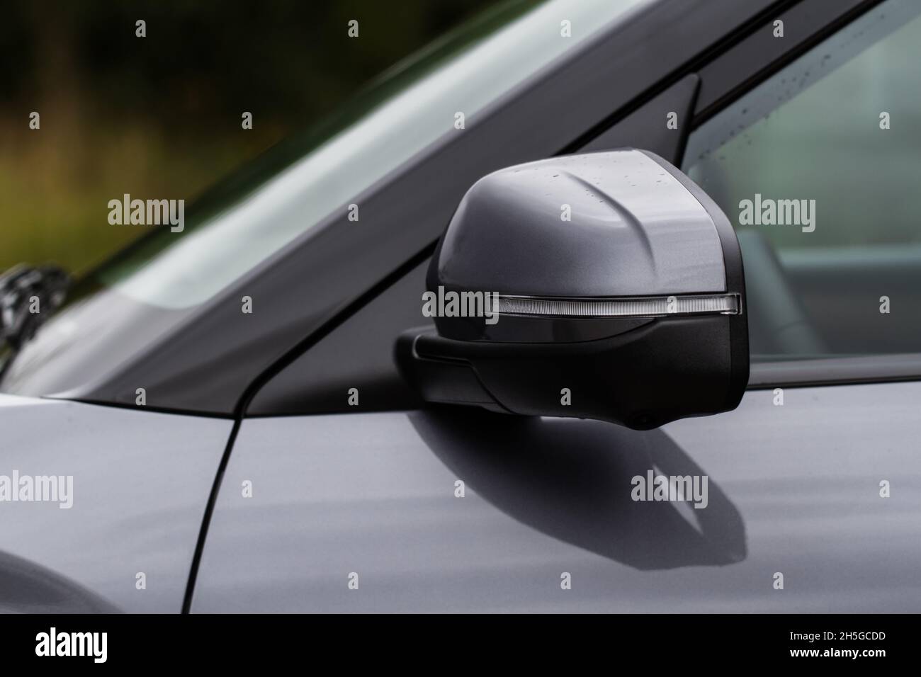 Close up front view of car side mirror. Front rear view mirror on the ...