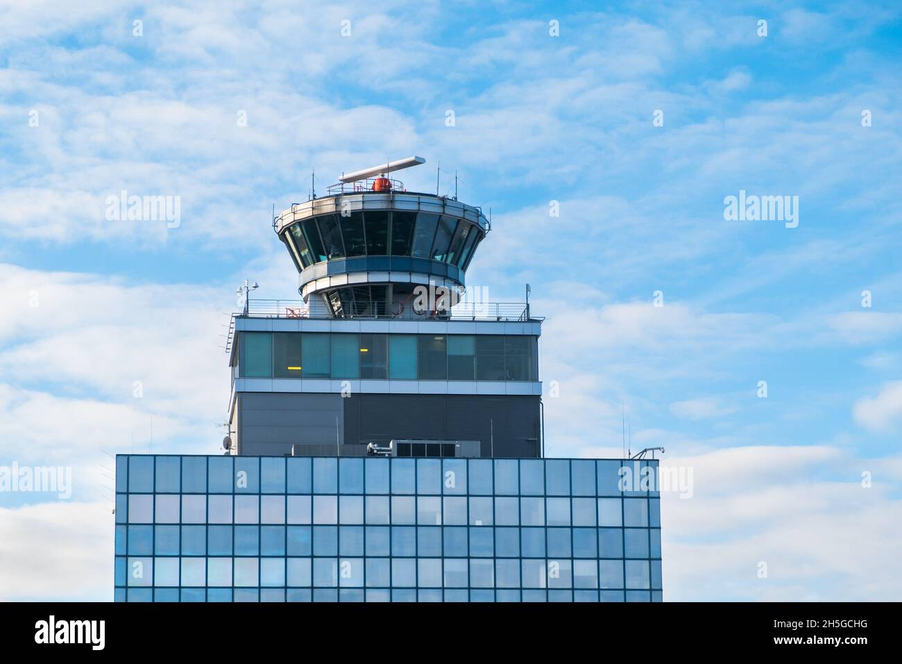 Functioning airport control tower with transparent booth. Air transport ...