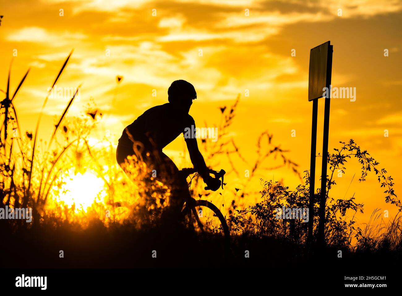 Sports and outdoor activities concept.Silhouette of cyclist riding a ...