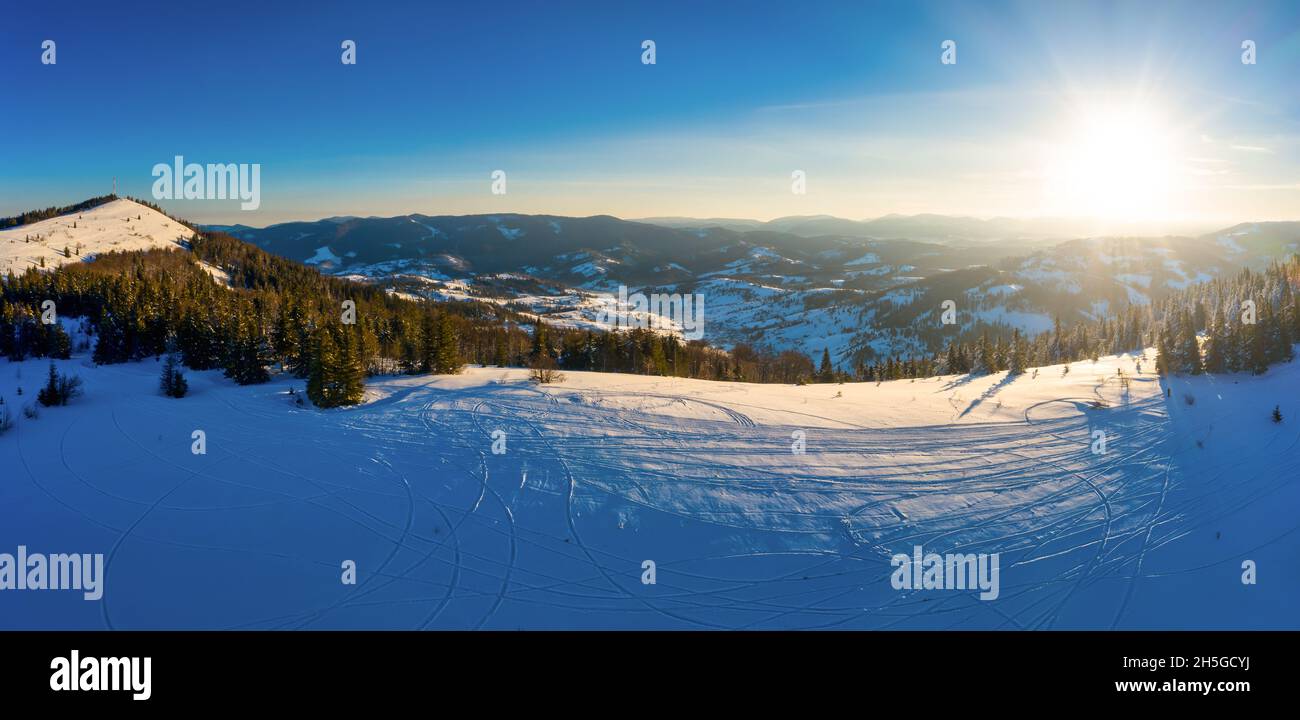 Aerial view of beautiful winter mountain slopes covered with snow and ...