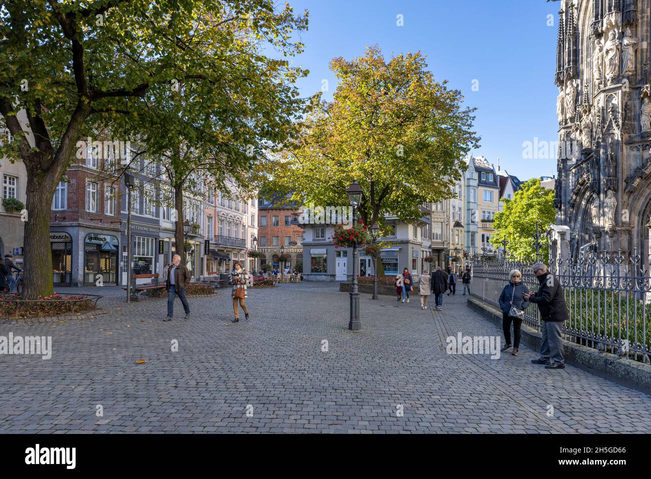 Narrow streets in Aachen old town with incidental people walking by ...