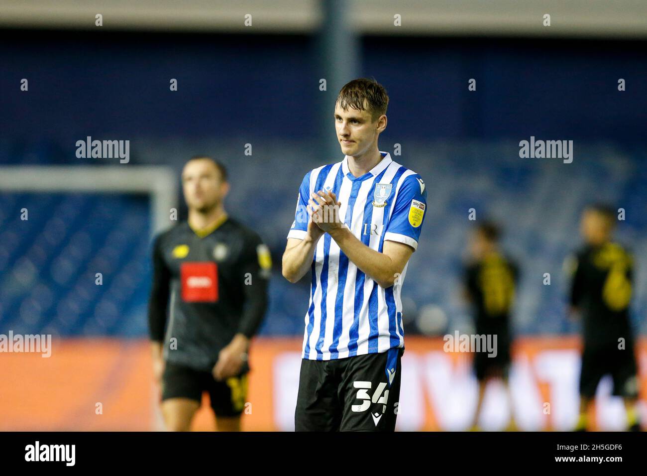 Sheffield, UK. 09th Nov, 2021. Ciaran Brennan #34 of Sheffield Wednesday applauds fans after the ...