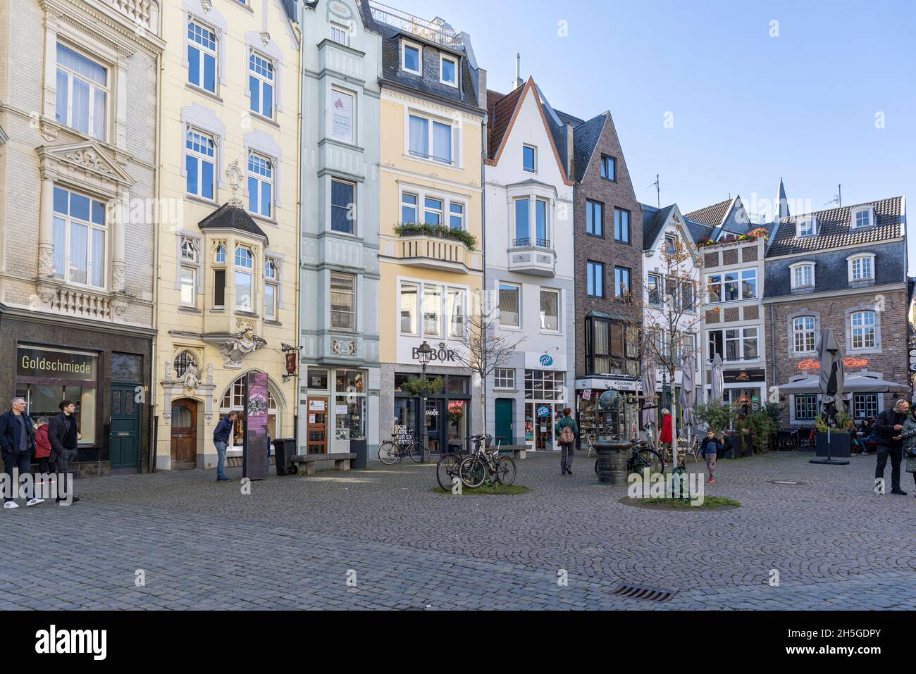 Narrow streets in Aachen old town with incidental people walking by ...