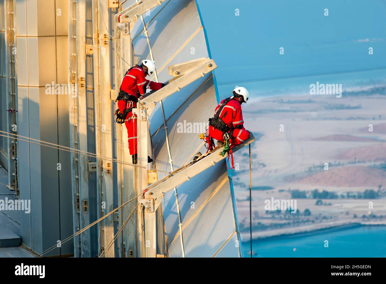 Window washers at work in the Persian Gulf, in Abu Dhabi City, UAE; Abu ...
