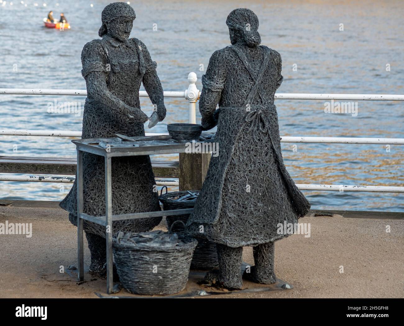The Herring Lasses sculpture in Whitby Harbour, North Yorkshire Stock ...