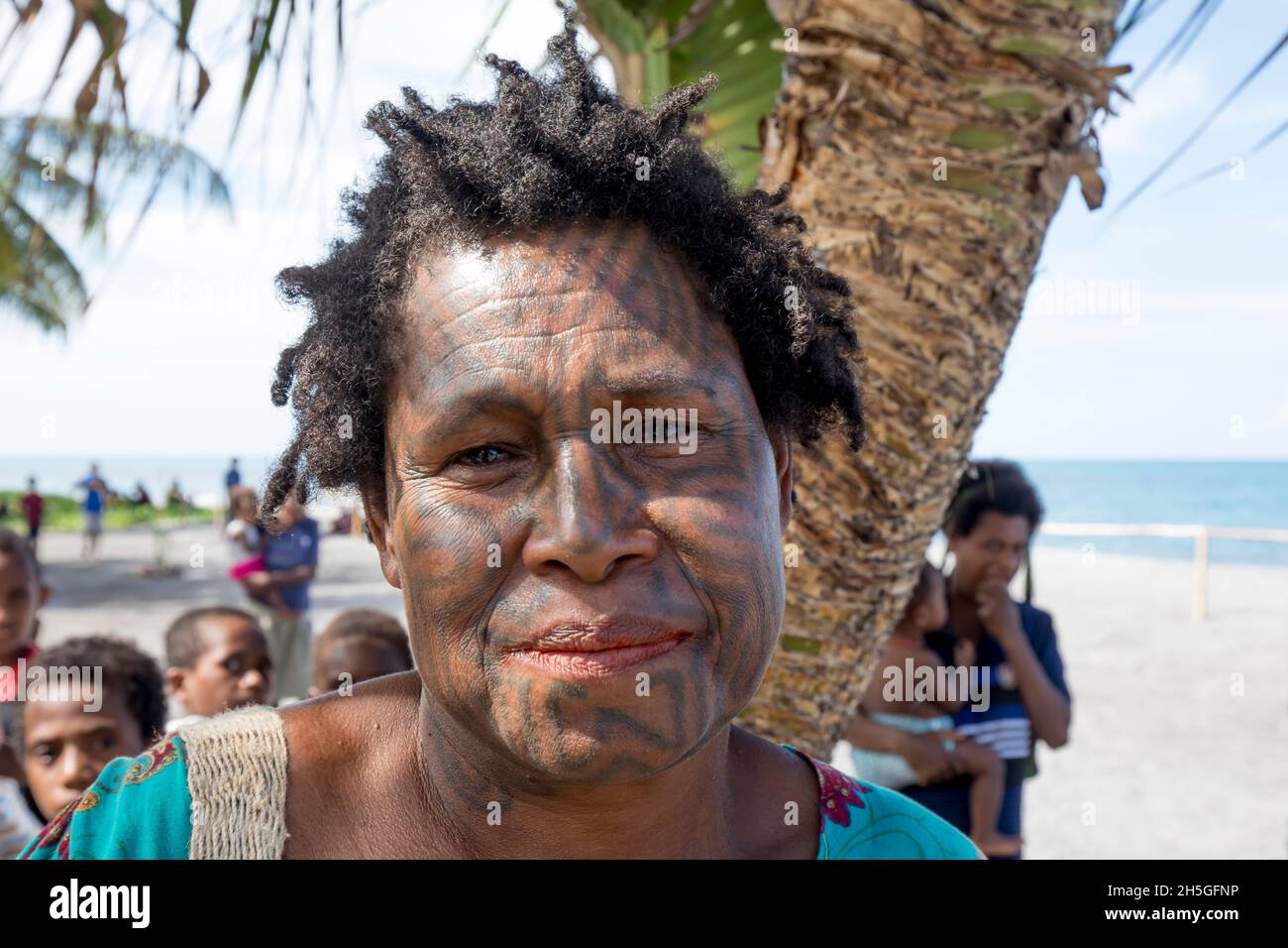 Woman with face tattoos on Buna Beach, Oro Province, Papua New Guinea ...