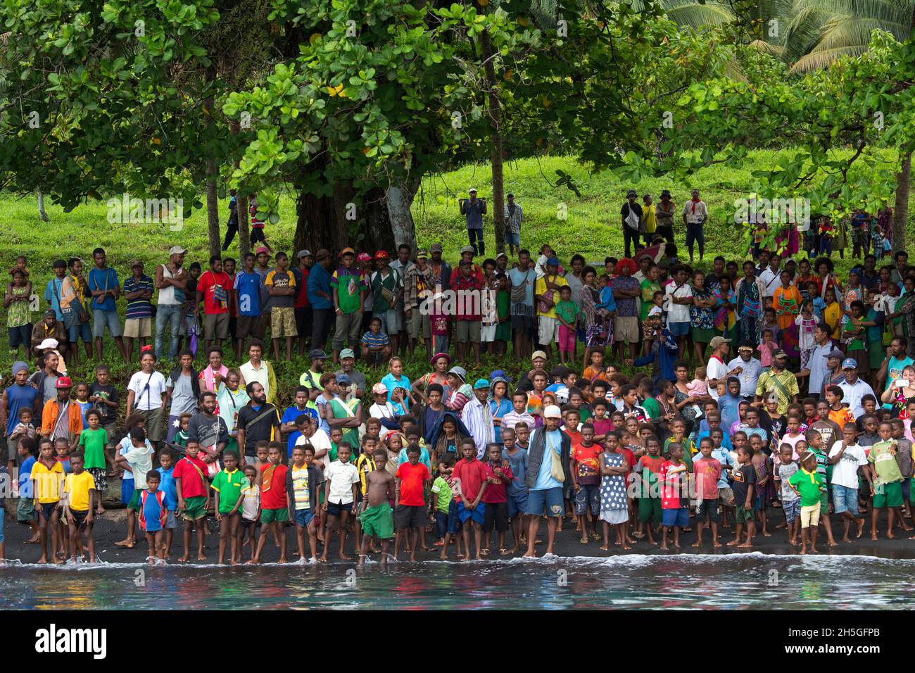 Crowd of villagers gathering to meet guests to Karkar Island, Papua New ...