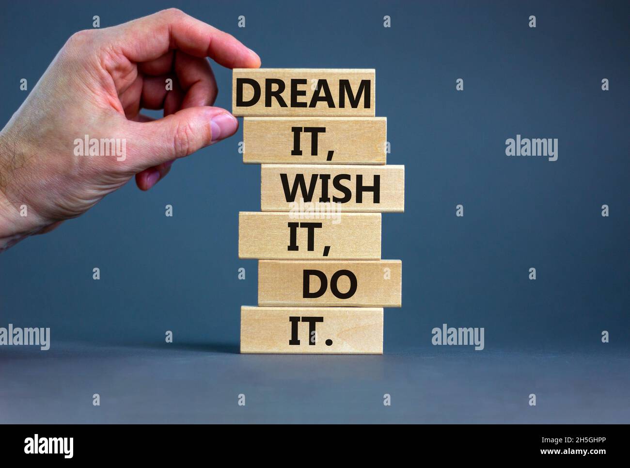 Dream wish and do it symbol. Wooden blocks with words Dream it, wish it ...