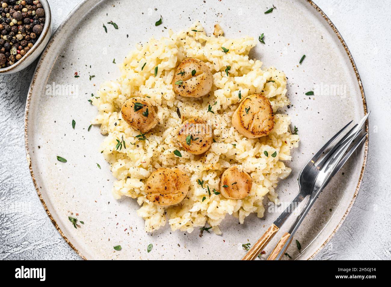 Italian Risotto with pan seared sea scallops. White background. Top ...
