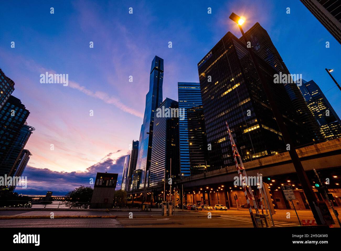 Early morning view of skyscraper glass facades reflecting the blue and ...