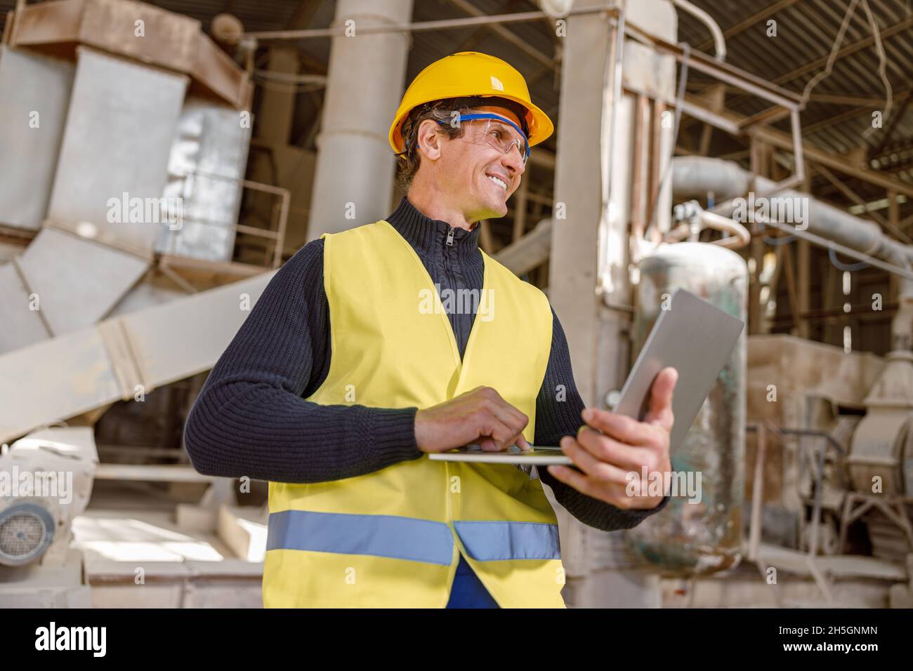 Positive male worker using hi-res stock photography and images - Alamy
