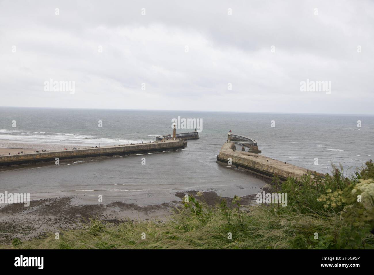 Robin Hood's Bay pier and dock Stock Photo - Alamy