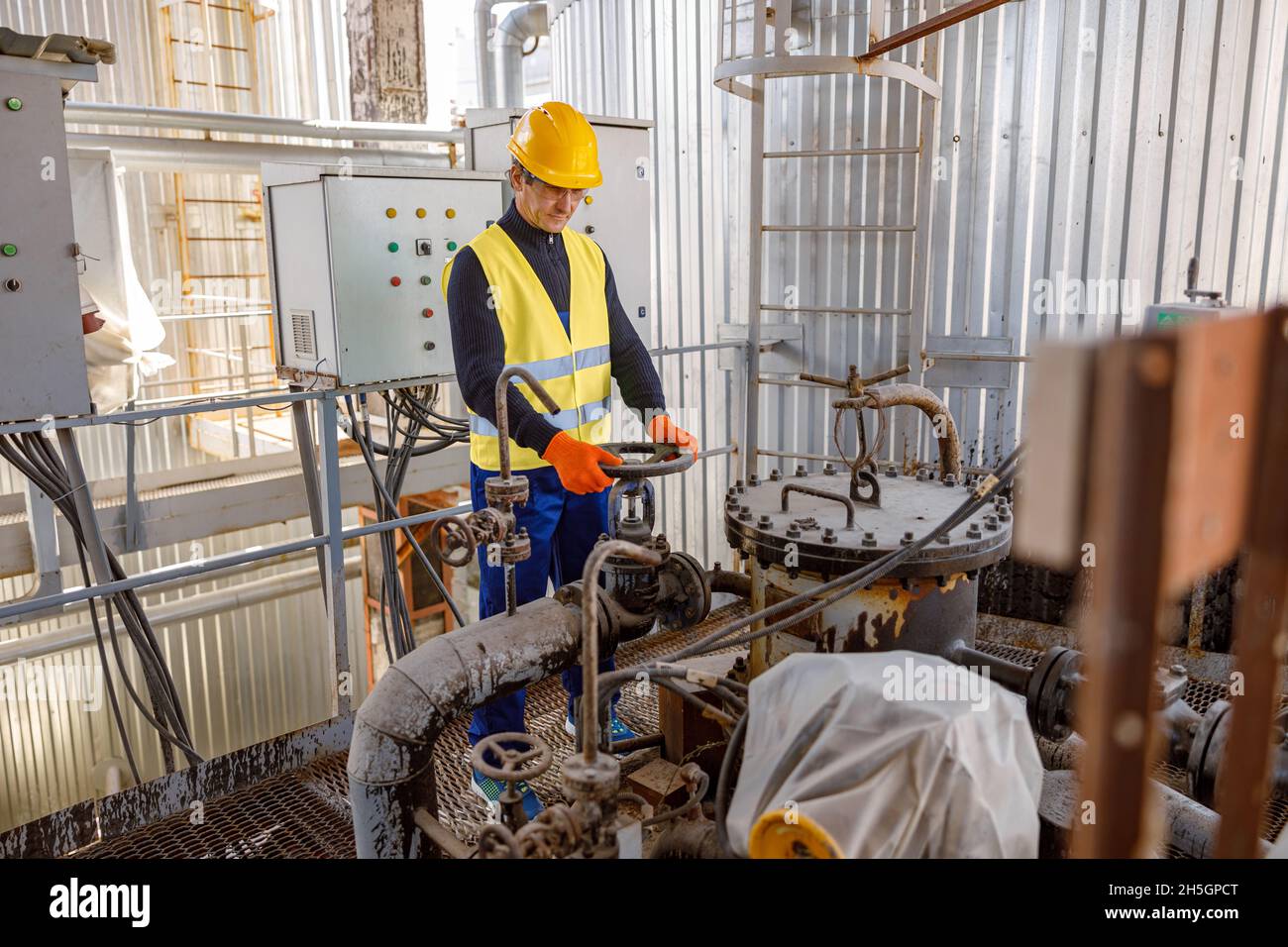 Male engineer working at petroleum industrial plant Stock Photo - Alamy