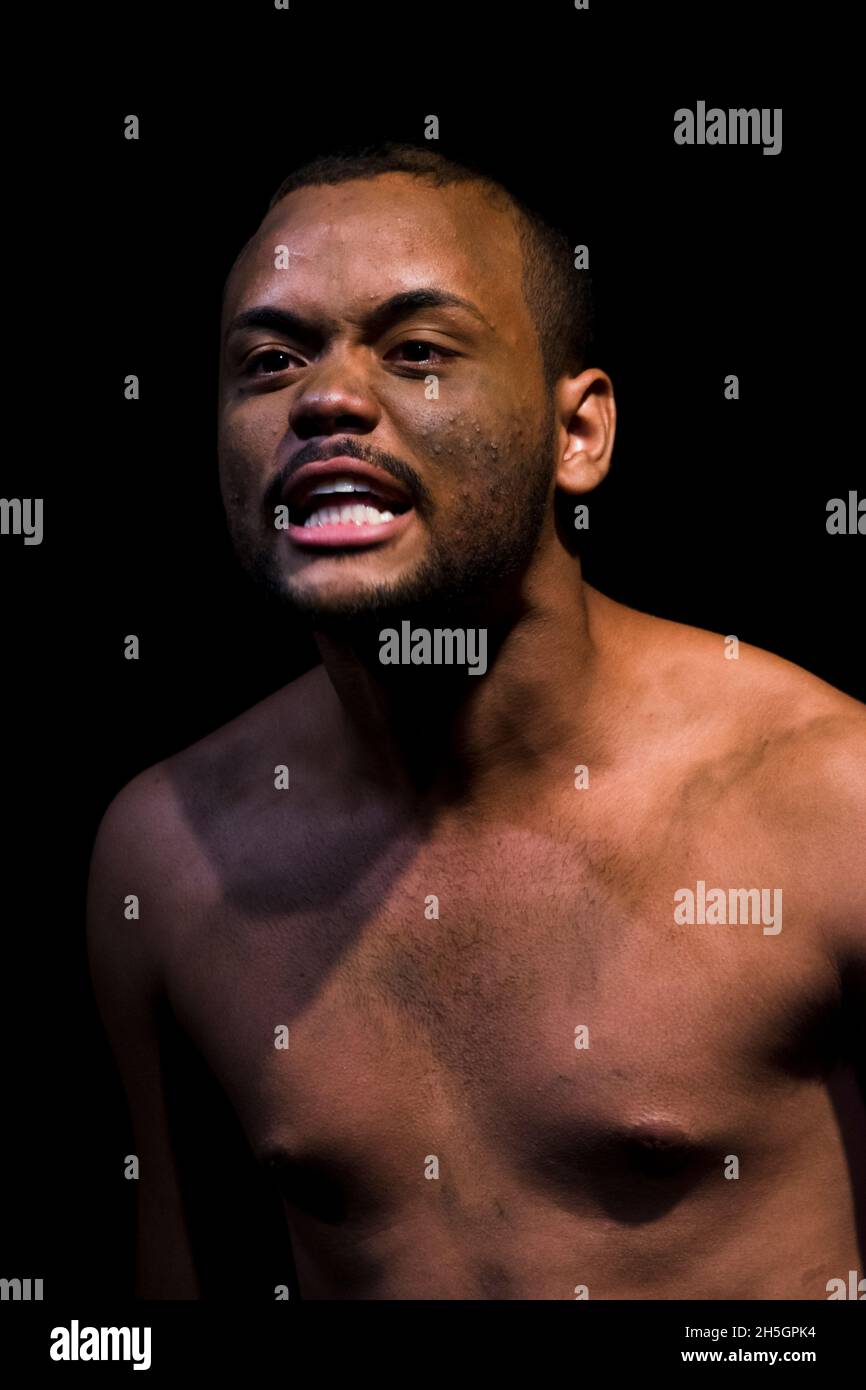 Actor on stage represents a dramatic character. Scene in a theater in ...