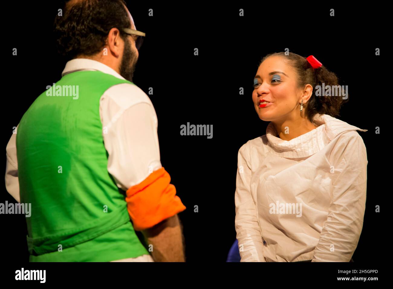 Actor and actress representing a character on stage in a theater. They ...