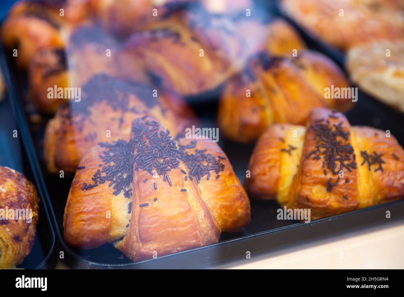 Chocolate croissants, spanish dessert on counter in supermarket Stock ...