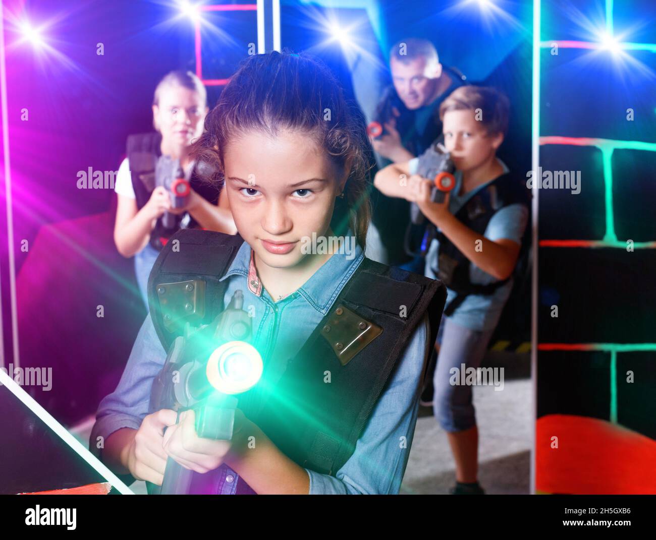 Portrait of teenager girl with laser gun having fun with her fam Stock ...
