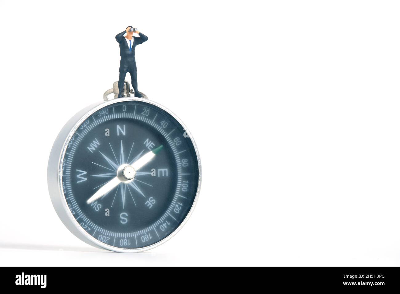 Man using compass on map Cut Out Stock Images & Pictures - Alamy