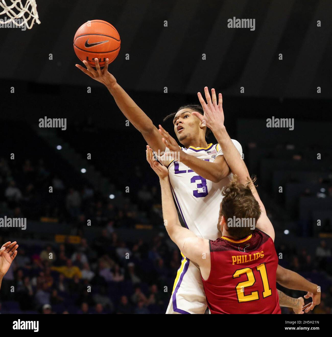 November 9, 2021: LSU's Alex Fudge (3) drives for a lay up past ULM's ...