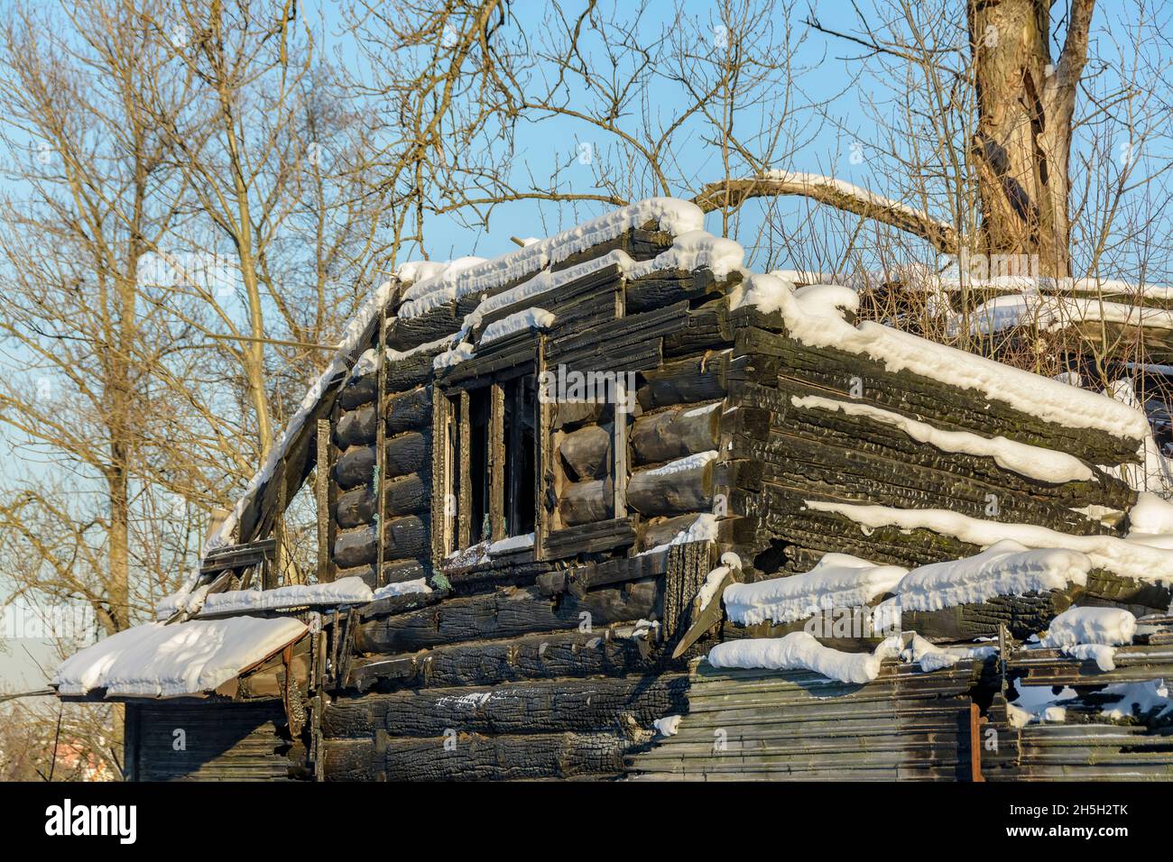 Remains of old wooden houses in the village of Ust-Slavyanka in the area of the construction of ...