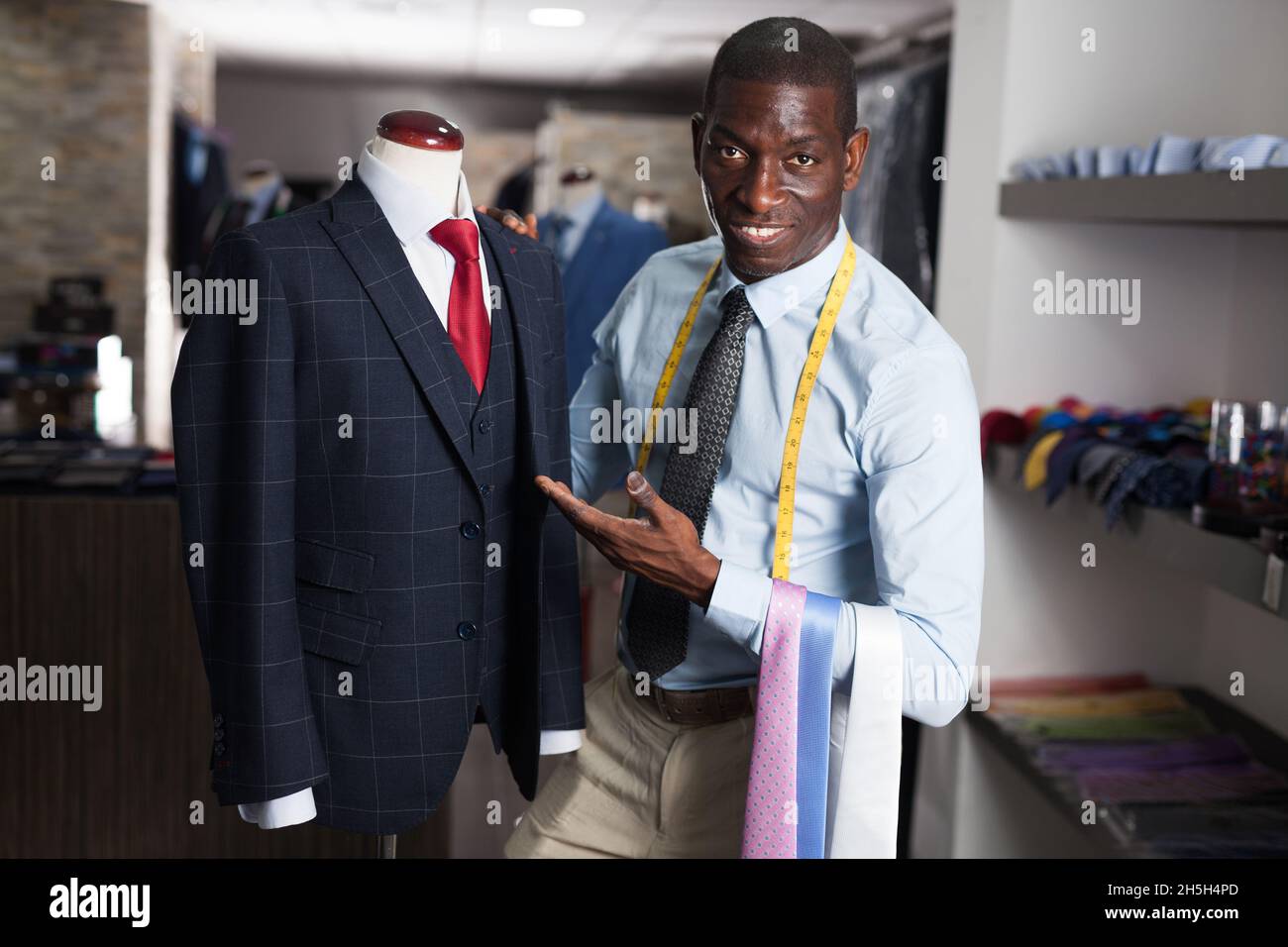 Portrait of African-american man customer choosing business style tie ...