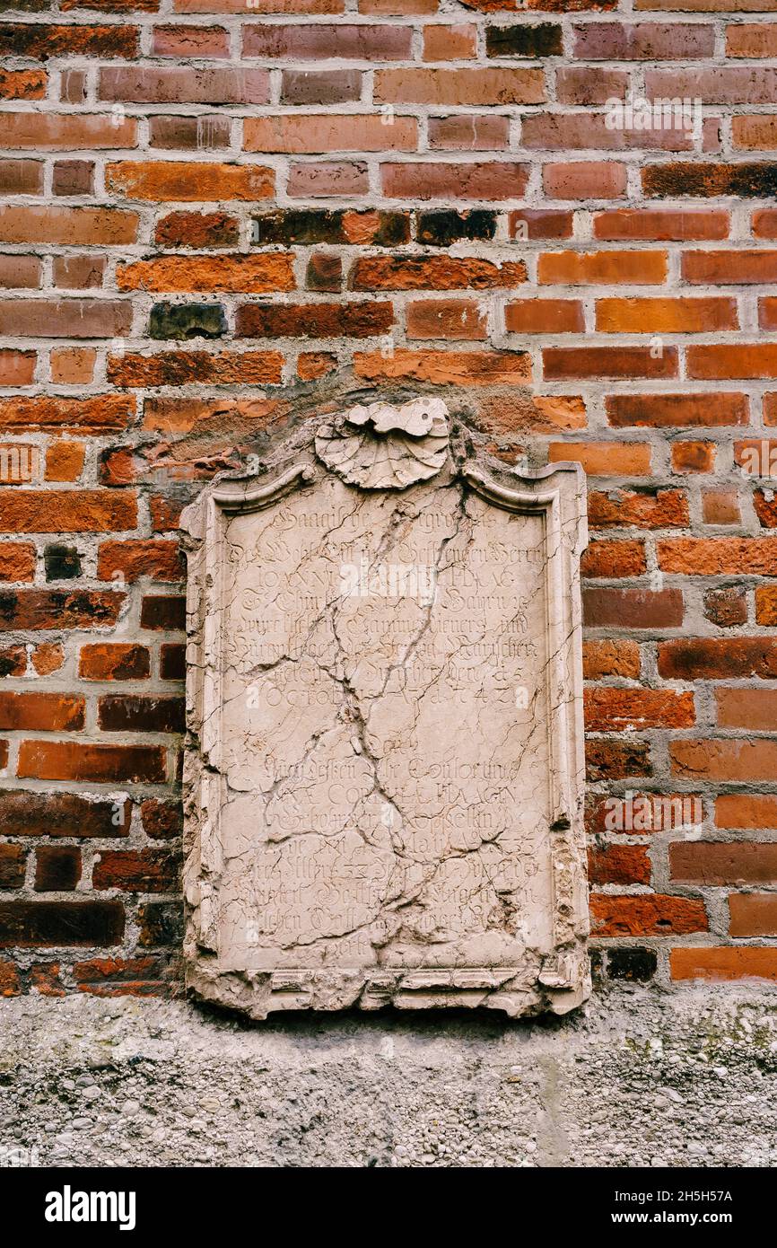 Historical gravestone on the facade of the Frauenkirche cathedral ...