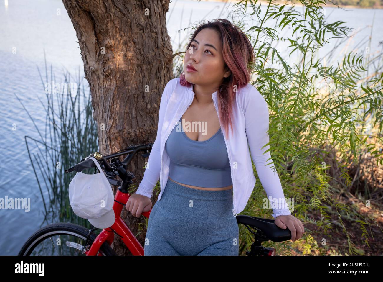 Leaning on bicycle hi-res stock photography and images - Alamy