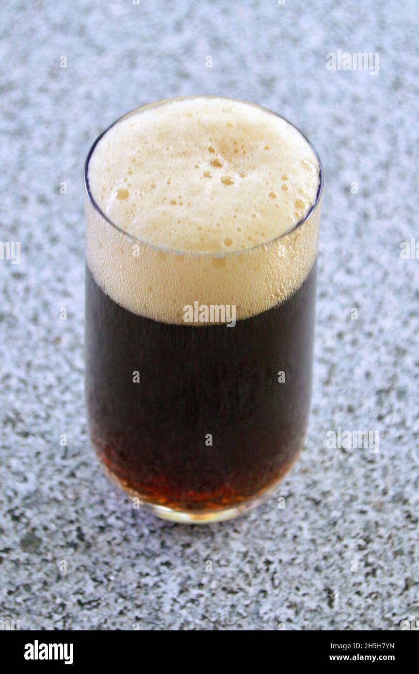 A brown ale on the table in a glass Stock Photo - Alamy