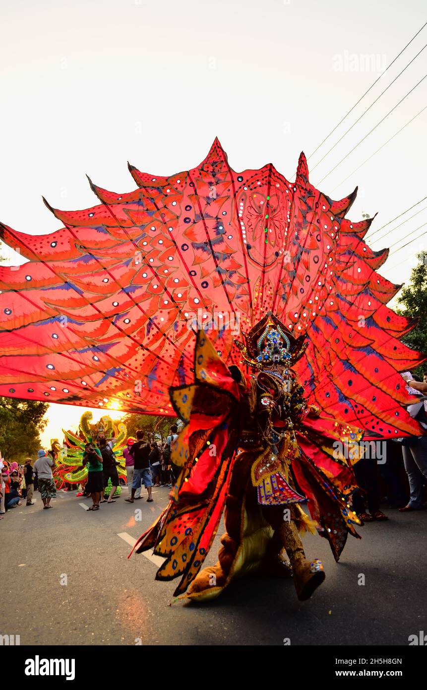 a woman wearing a costume at a carnival batik solo, surakarta, central ...