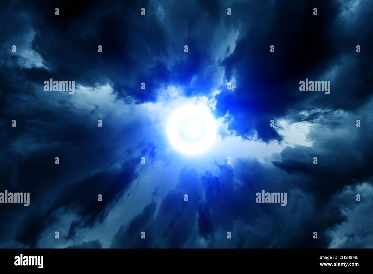 Blue Light in the Dark and Dramatic Storm Clouds Stock Photo - Alamy
