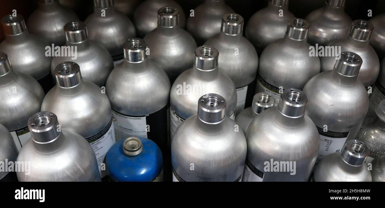 A collection of silver gas cylinders Stock Photo - Alamy
