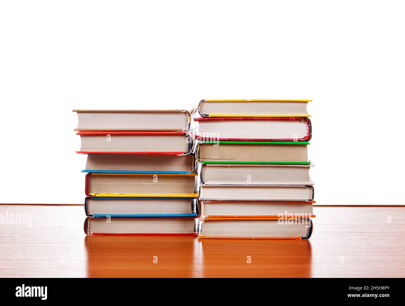 Pile of the Books on the Table Isolated Stock Photo - Alamy