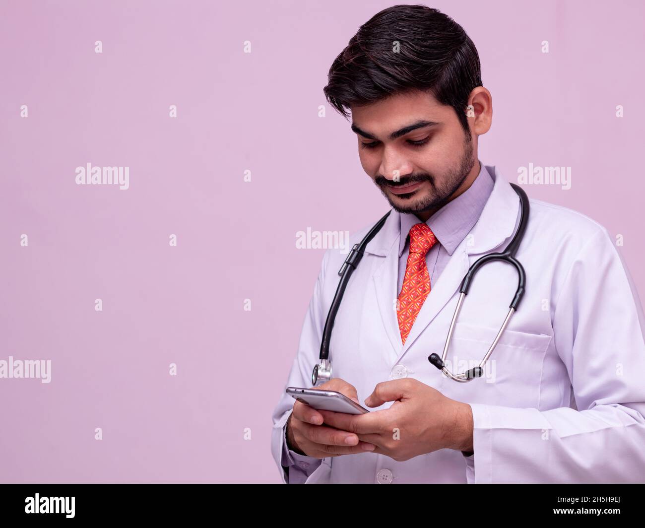Male nurse holding stethoscope hi-res stock photography and images - Alamy
