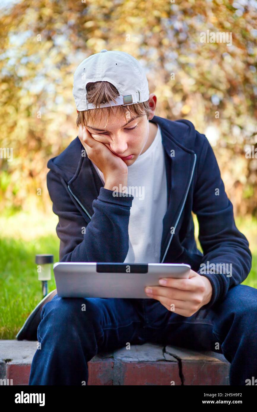 Sad teen boy computer hi-res stock photography and images - Alamy