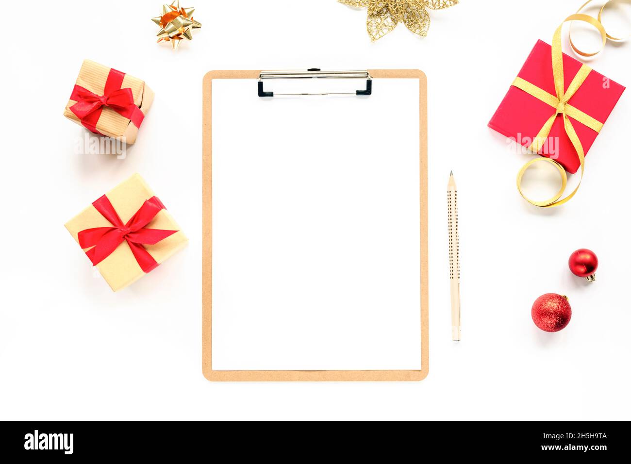 Festive Christmas background with white notepad sheet, present boxes ...