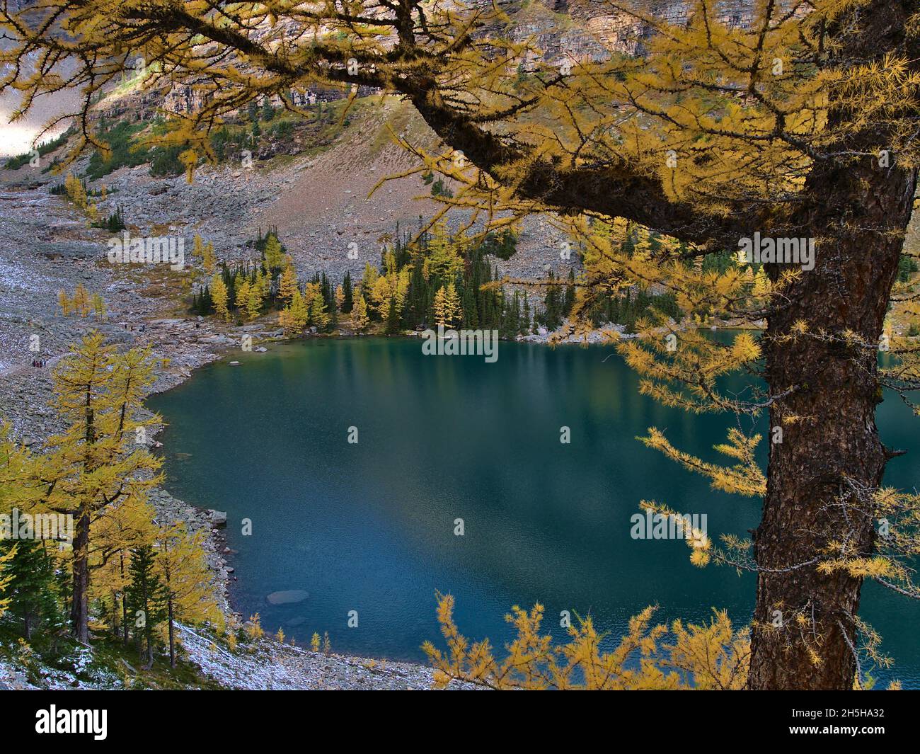 High angle view of Lake Agnes with shimmering water viewed through the ...