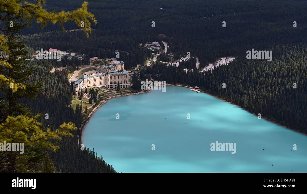 Aerial view of Lake Louise with famous hotel on the shore, parking ...
