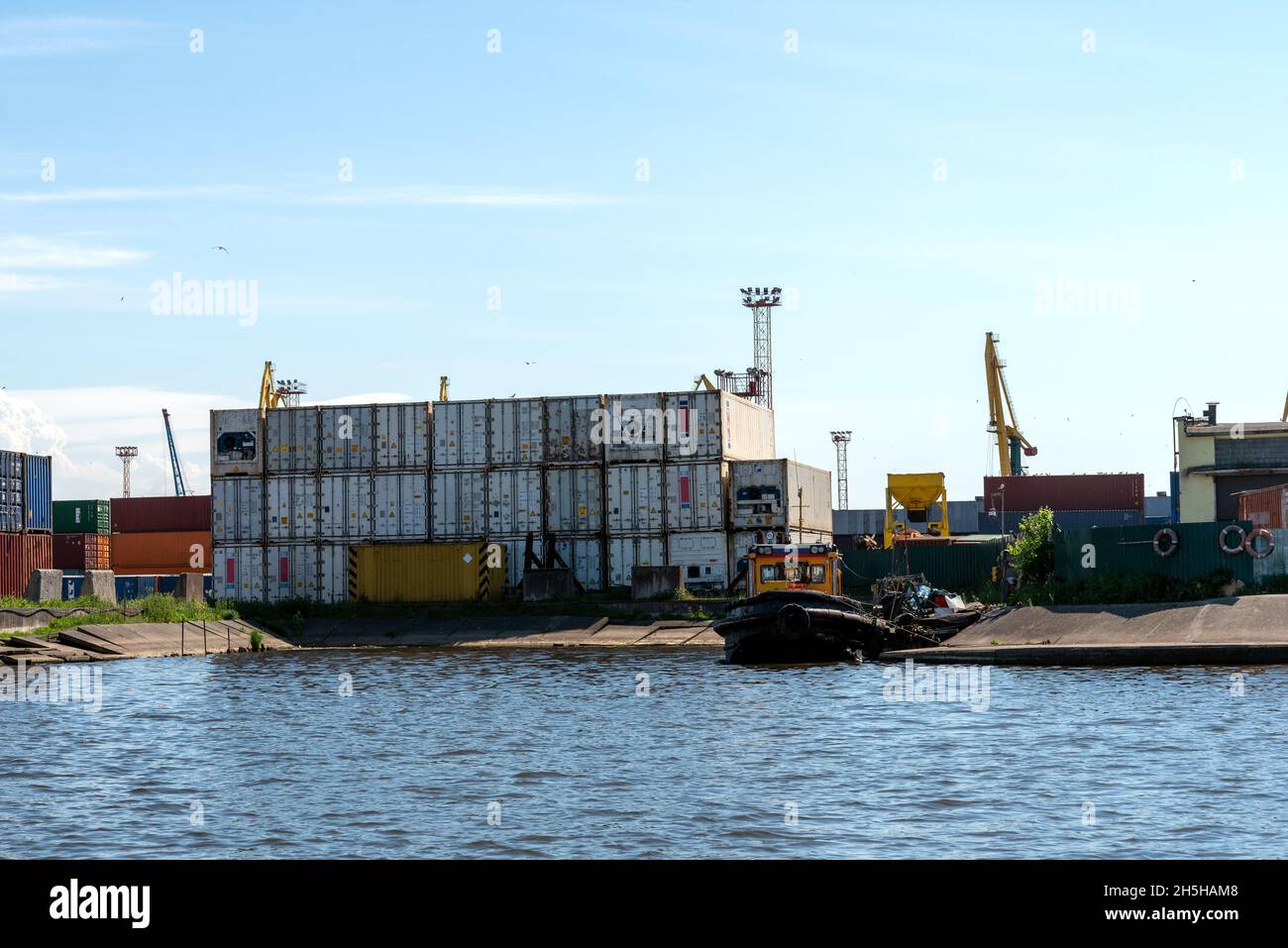 A stack of cargo containers in the docks, Containers at the pier. The ...