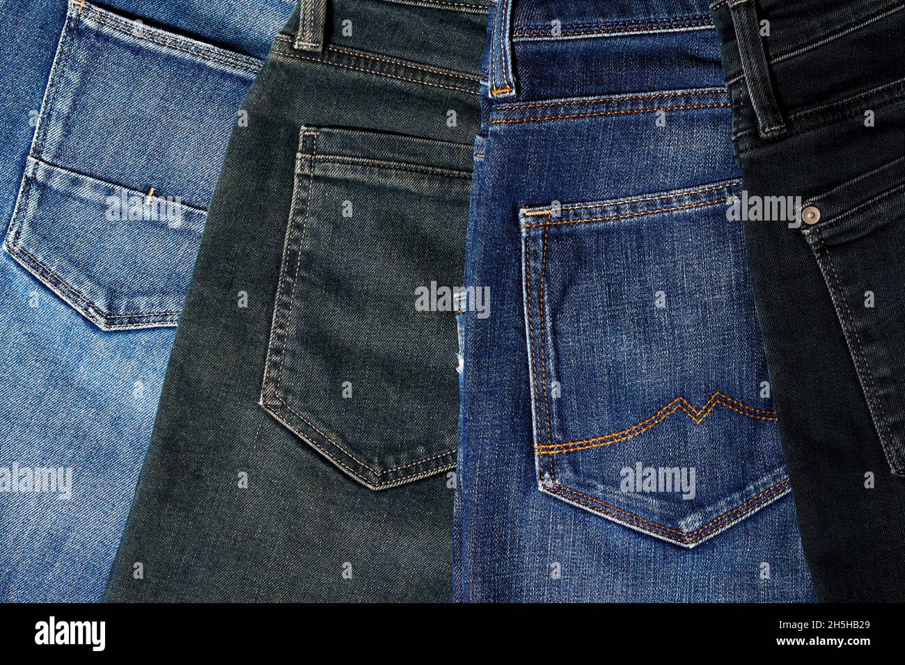 Set of different jeans and pockets in the clothes store. Fashion shop ...