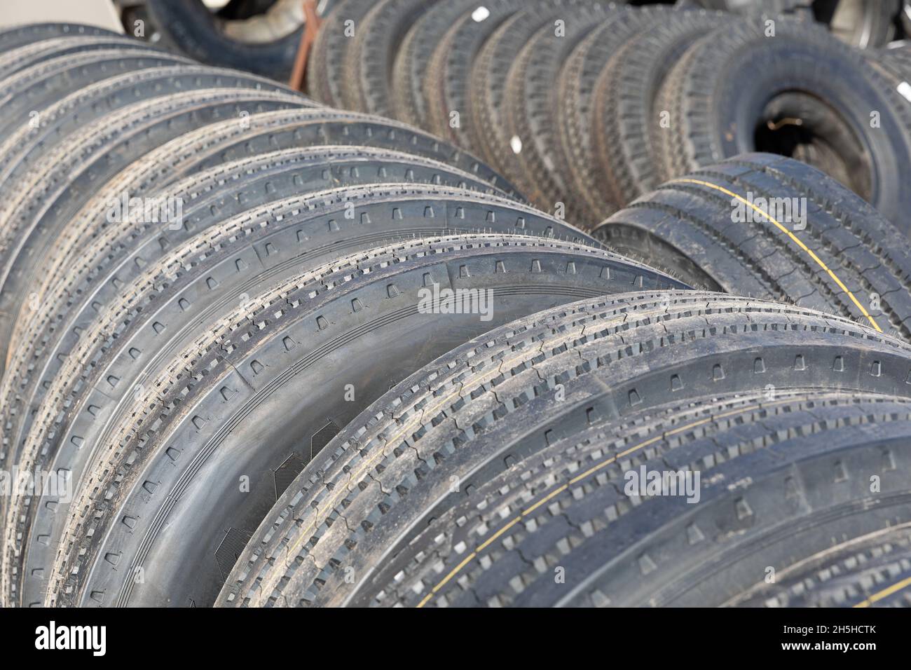 Photo of black big tires on wheels for large cars Stock Photo - Alamy