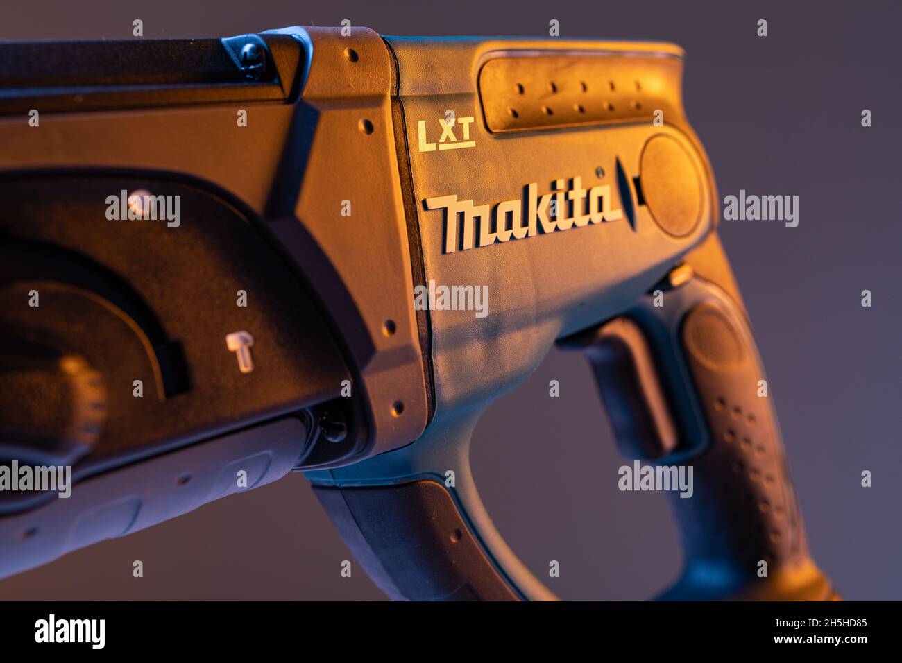 Closeup Neon photo of Makita drill instrument for drilling holes ...
