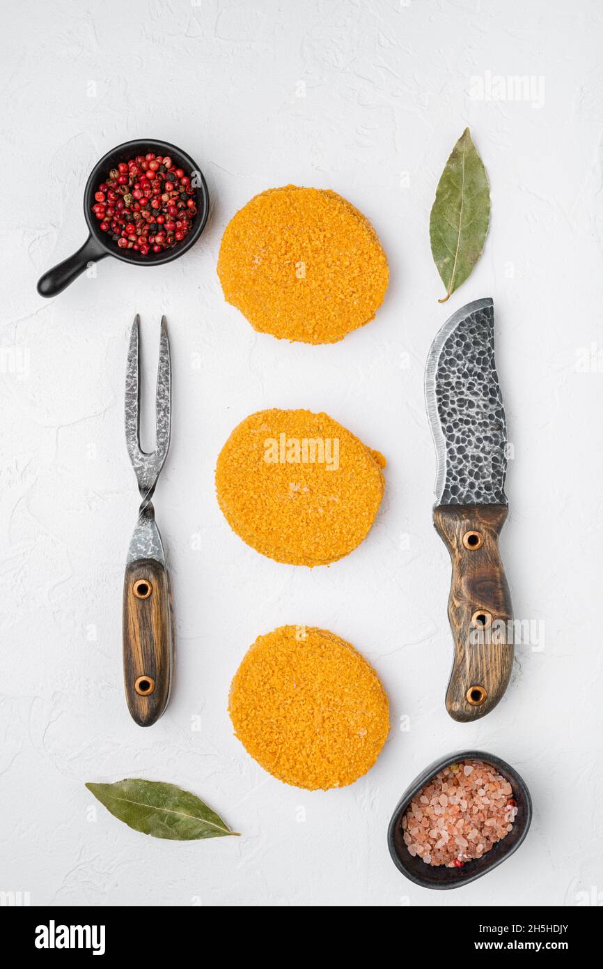 Breaded fish patties set, on white stone table background, top view ...