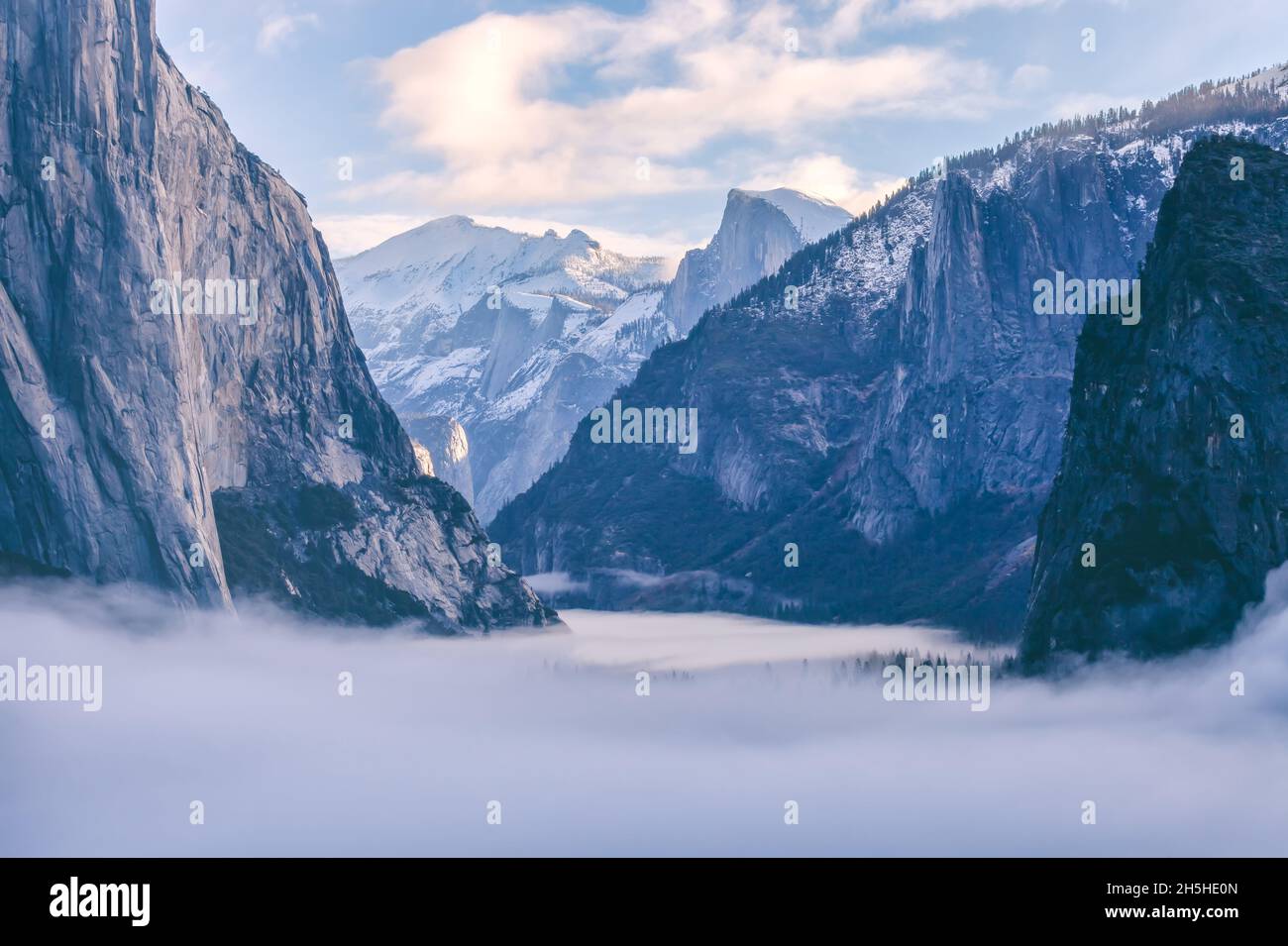 Low fog cover the Yosemite Valley, seen from the iconic Tunnel View ...