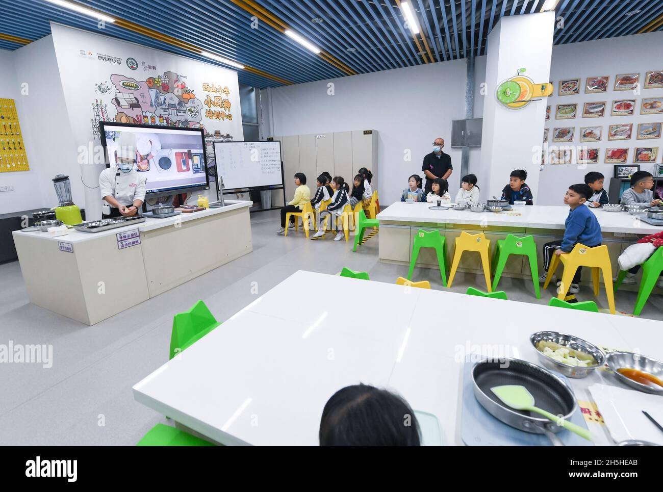 Cooking school teacher instructs hi-res stock photography and images ...