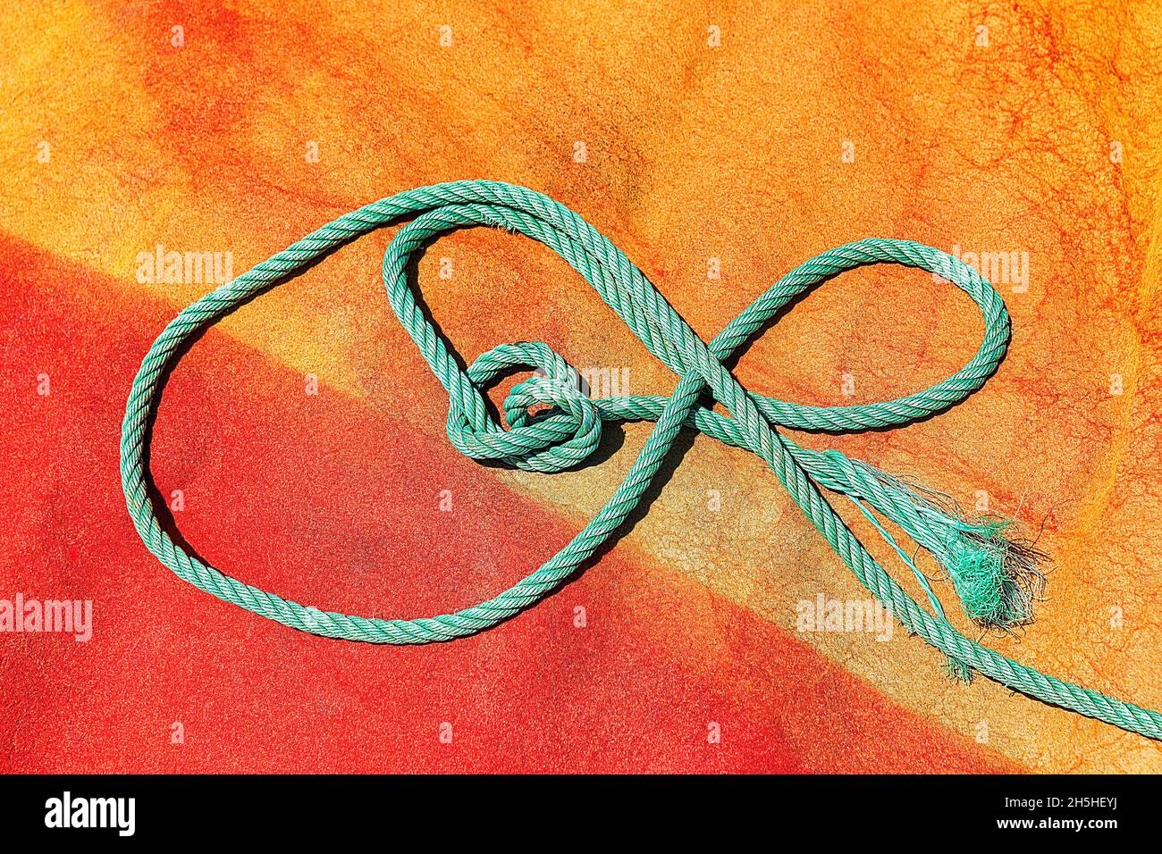 Turquoise green rope, rope with knots, Porto Covo harbour, Sines ...